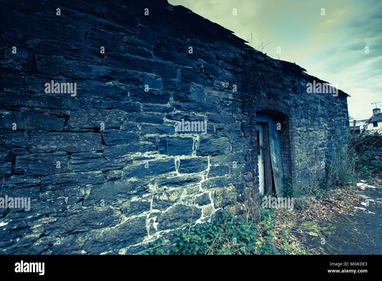 Derelict barn on british countryside.Dark and moody image of empty ...