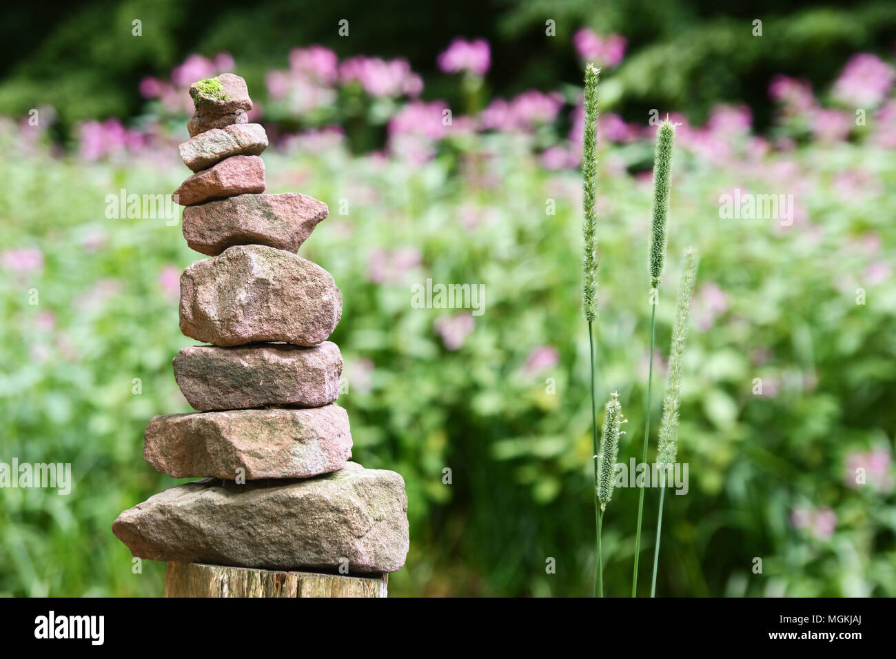 Stacked stone pyramid from sandstone as a sign for awareness on a sunny ...