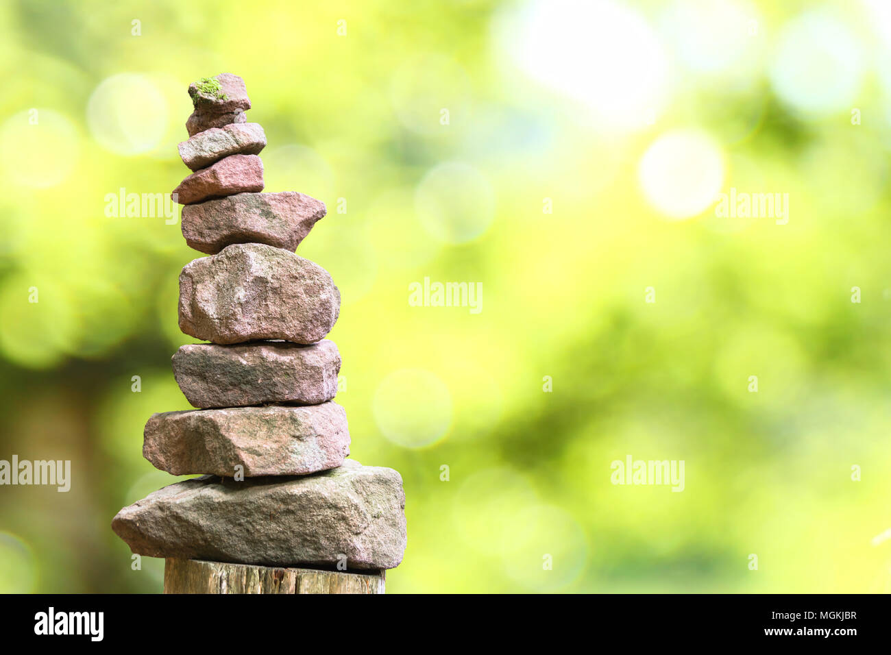 Stacked stone pyramid in front of blurry background with bokeh Stock ...
