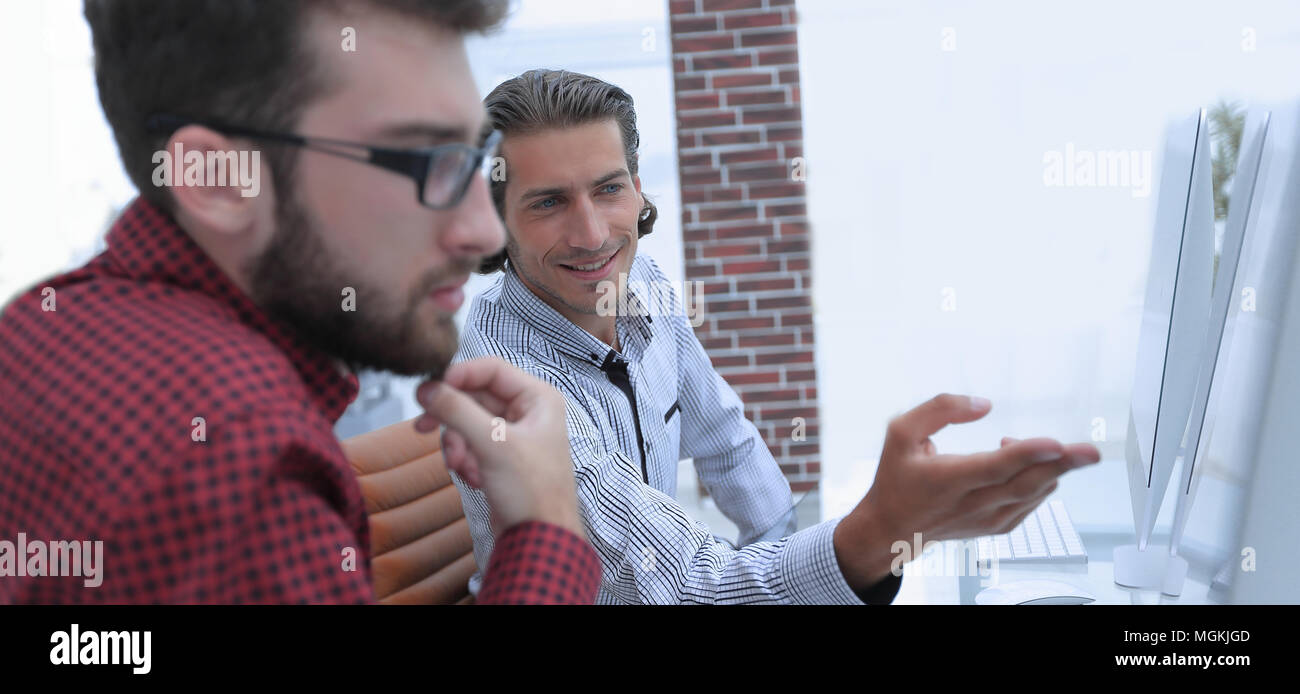 employees sitting behind a Desk Stock Photo - Alamy