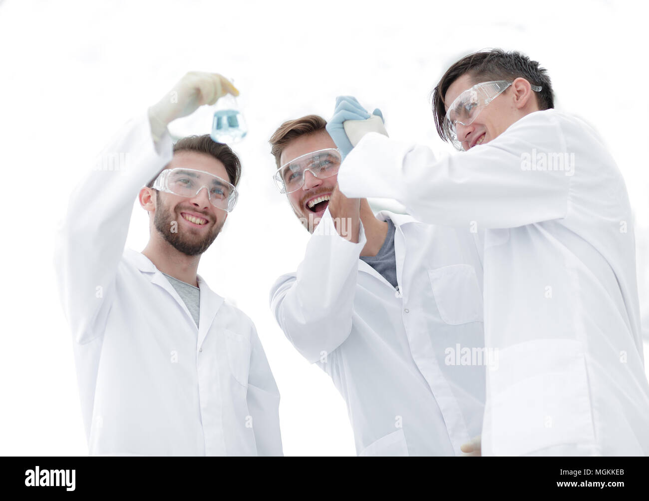 happy scientists look at the result of their work Stock Photo - Alamy