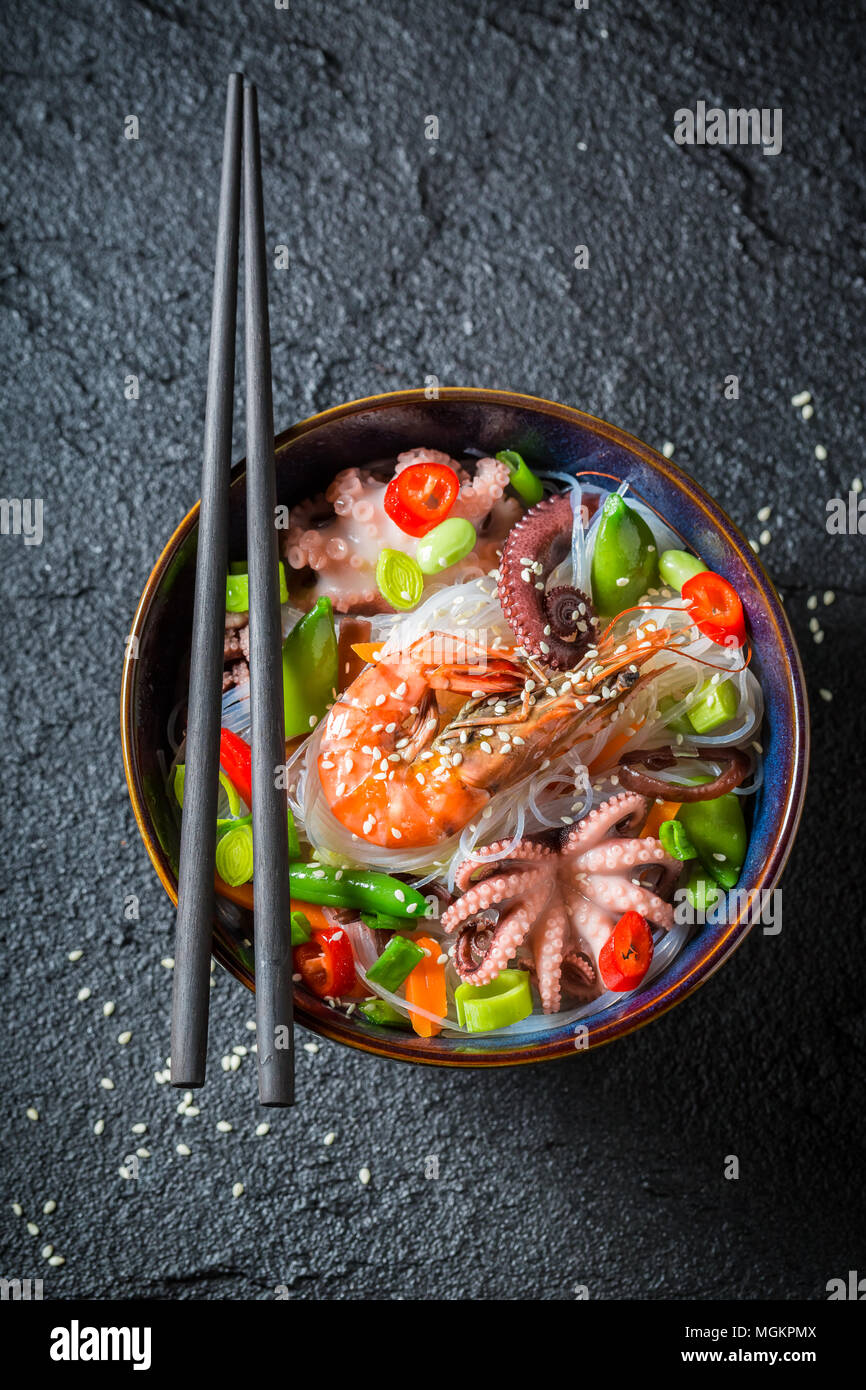 Delicious seafood noodle with octopus and prawn Stock Photo - Alamy