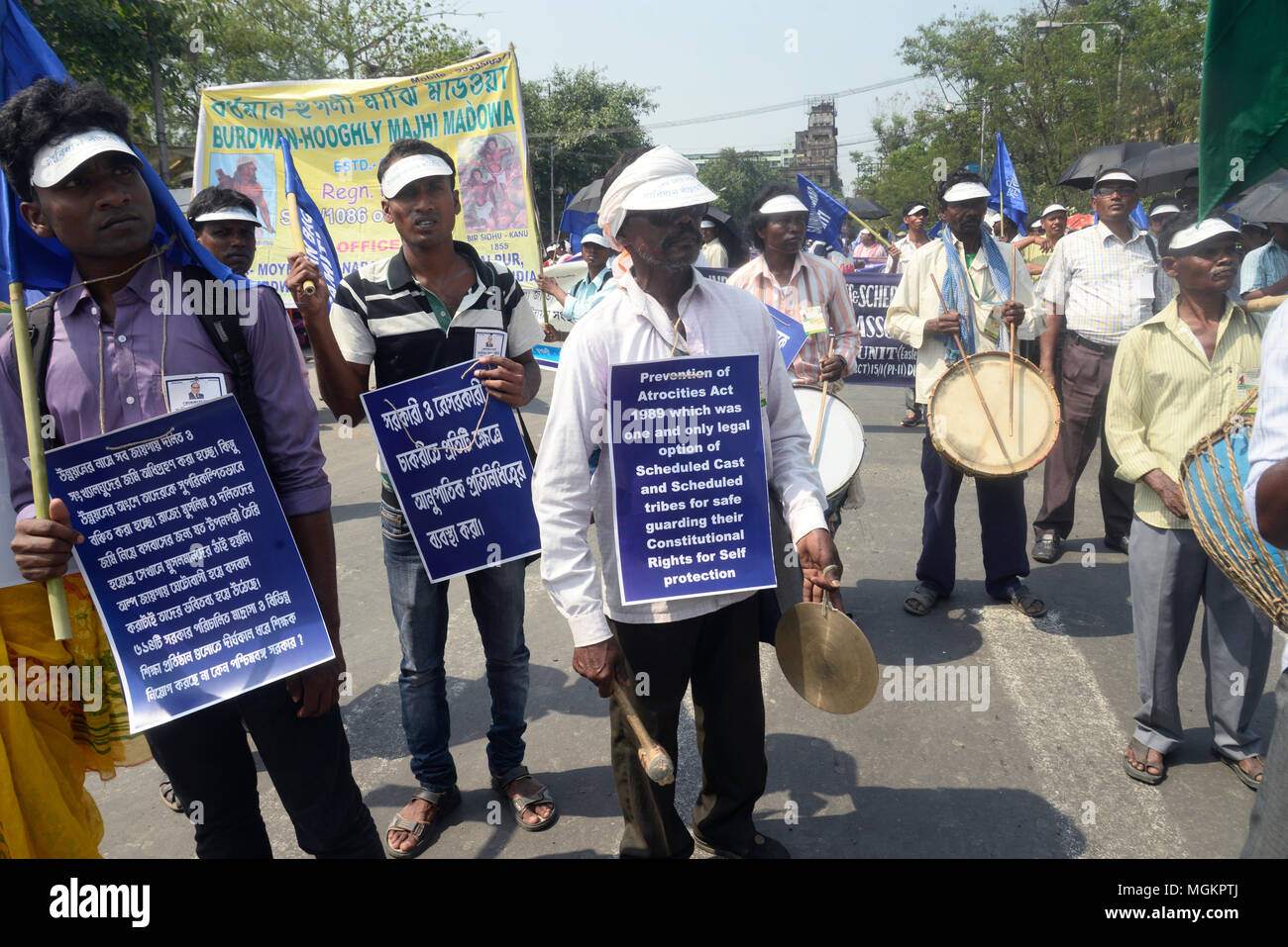 Kolkata, India. 28th Apr, 2018. SC, ST and OBC people hold poster and ...