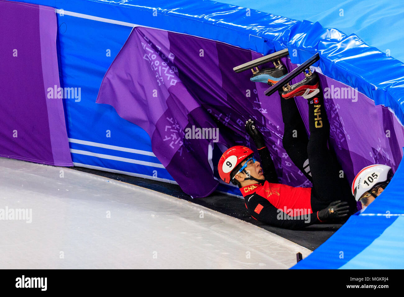 Tianyu Han (CHN) and Yuri Confortola (ITA) after crashing in the Men's 1,500m short track speed ...