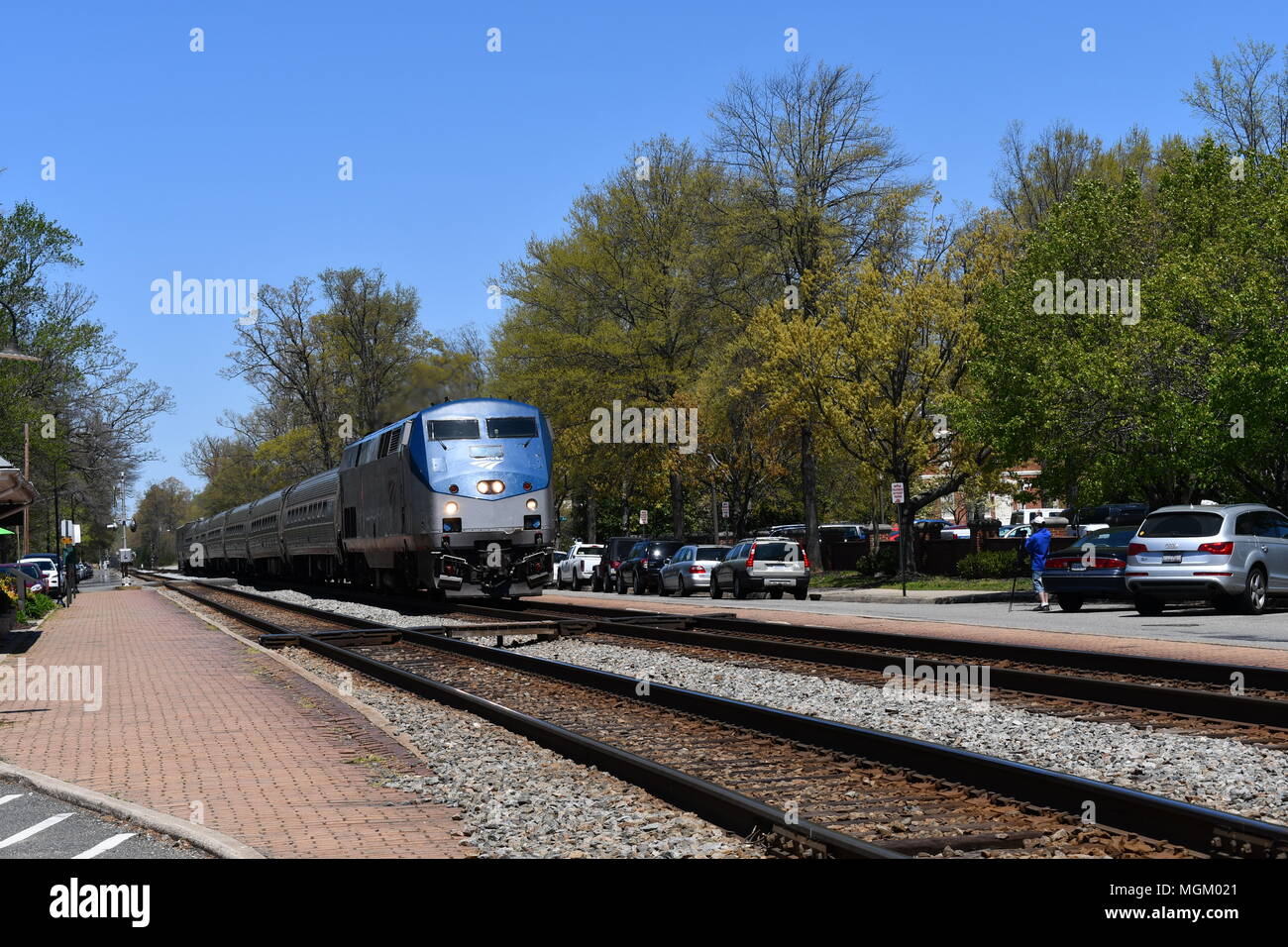 Amtrak train coming through Main Street of a small town in America ...