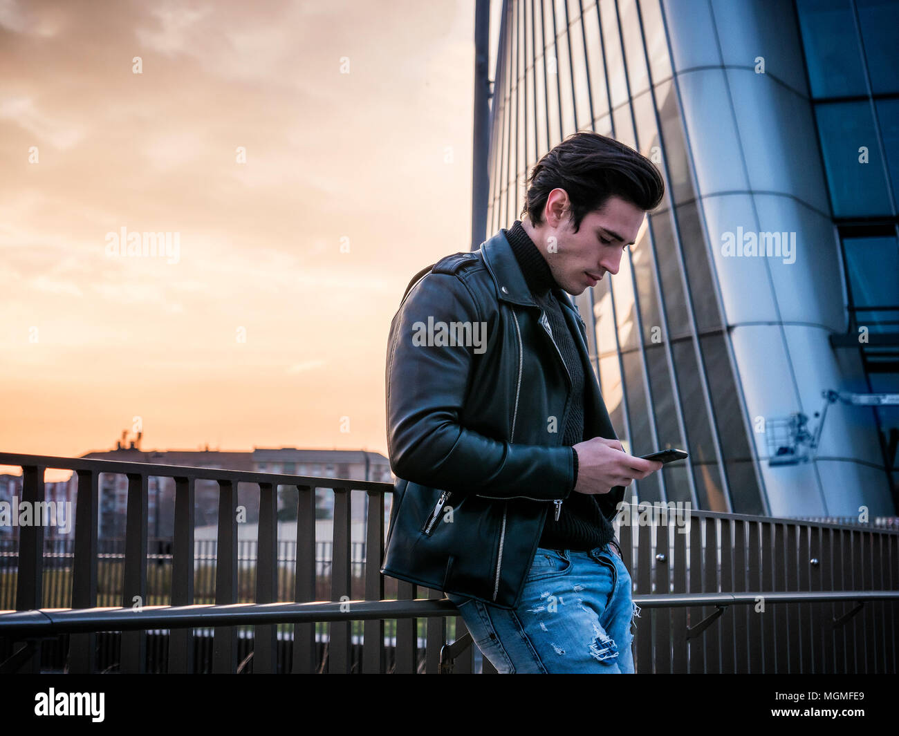 One handsome young man in modern city setting Stock Photo - Alamy