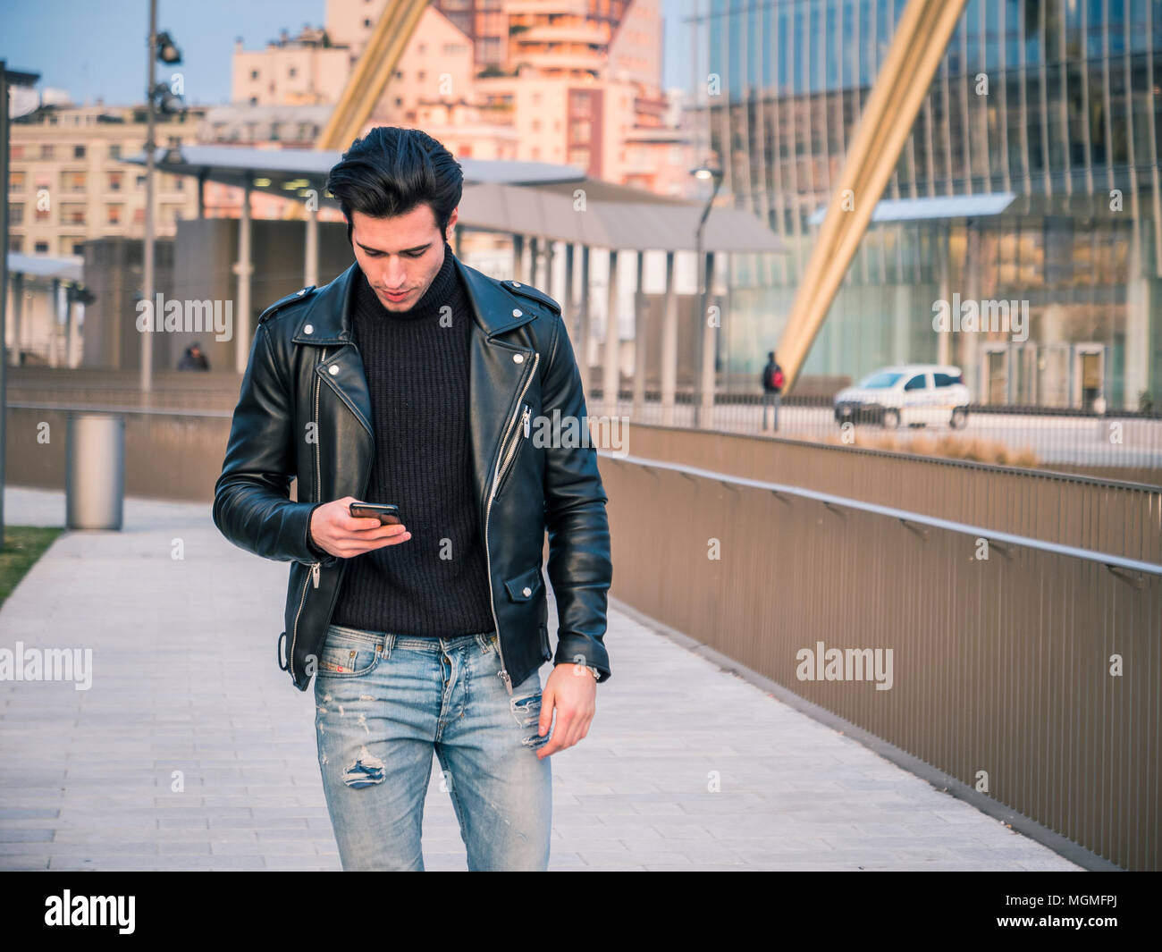 One handsome young man in modern city setting Stock Photo - Alamy