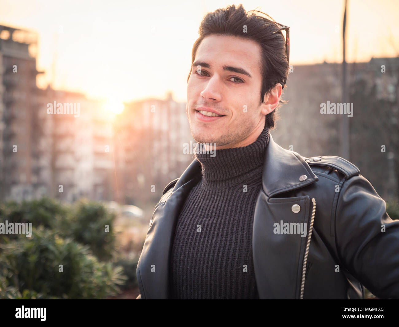One handsome young man in modern city setting Stock Photo - Alamy