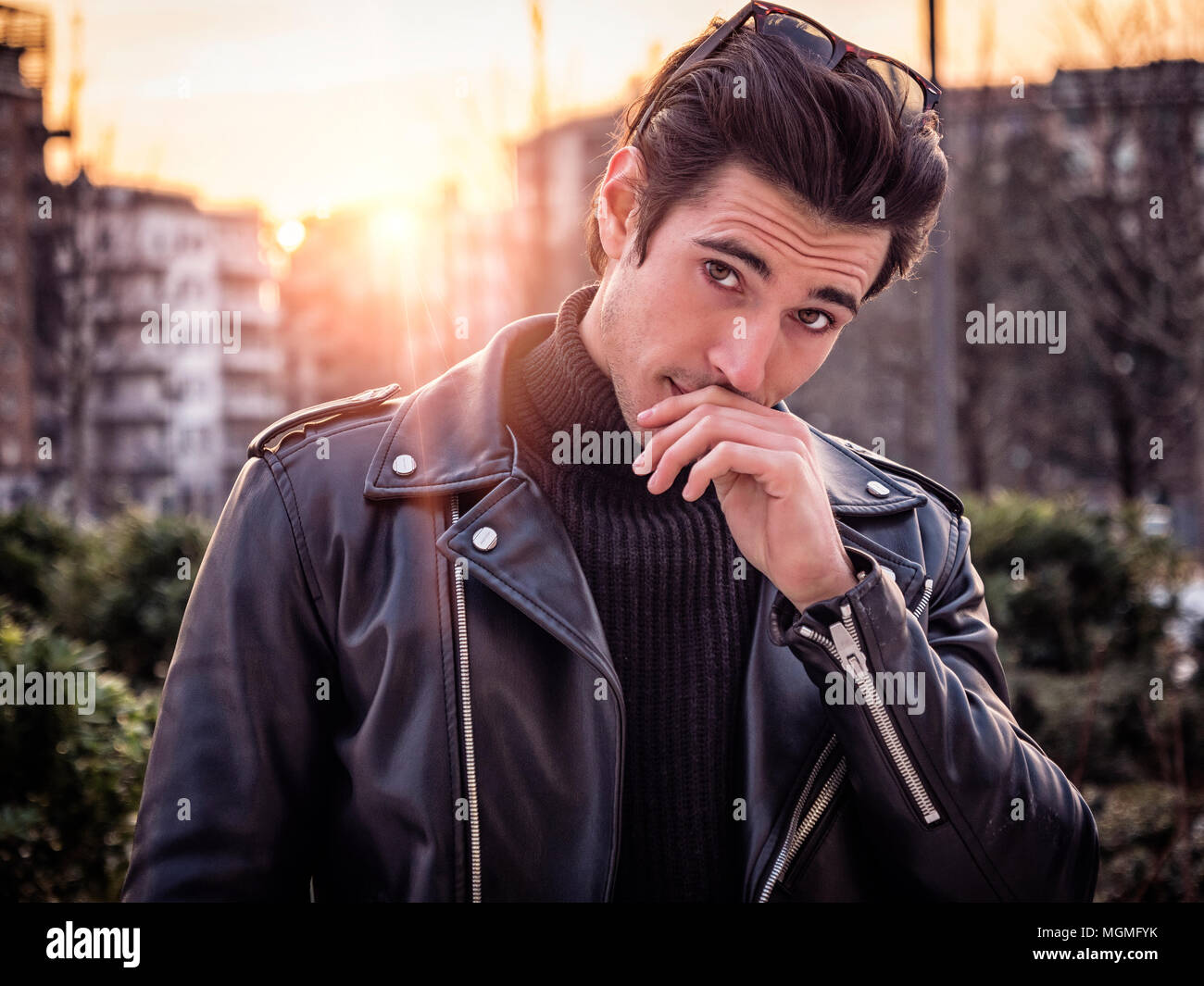 One handsome young man in modern city setting Stock Photo - Alamy