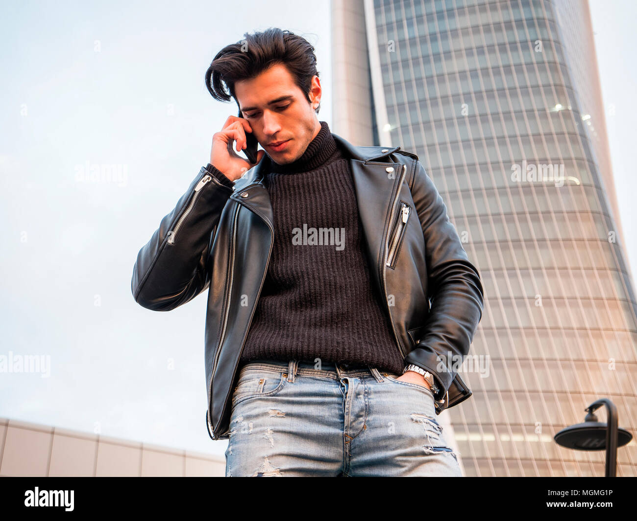 One handsome young man in modern city setting Stock Photo - Alamy