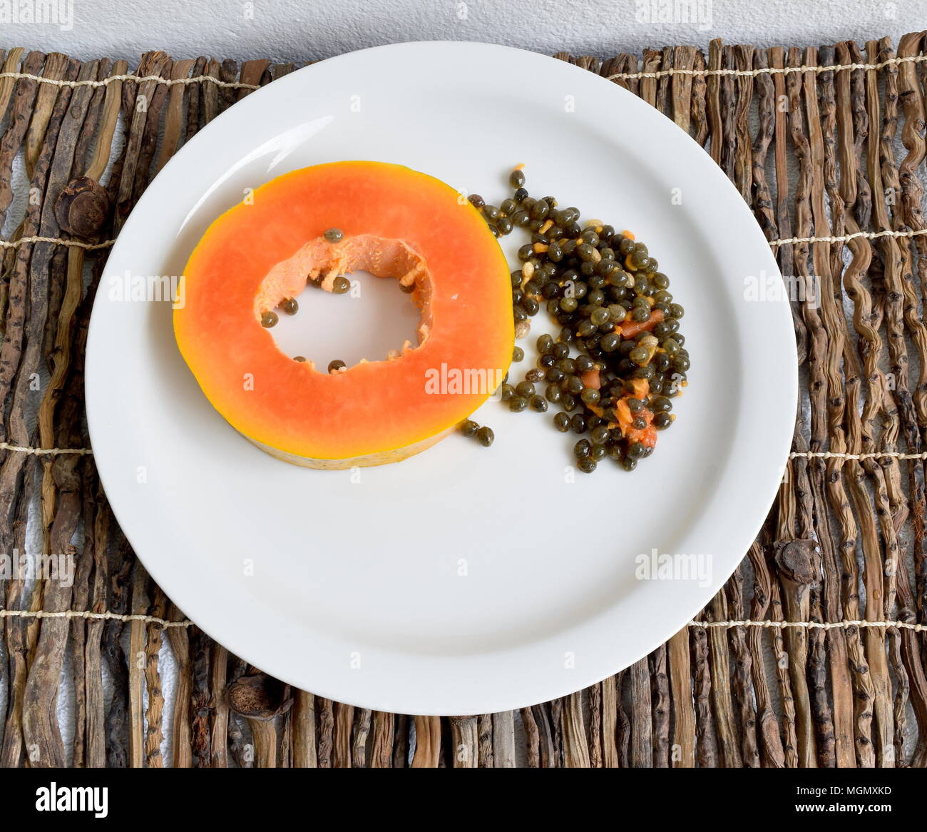 Sliced papaya on plate hi-res stock photography and images - Alamy