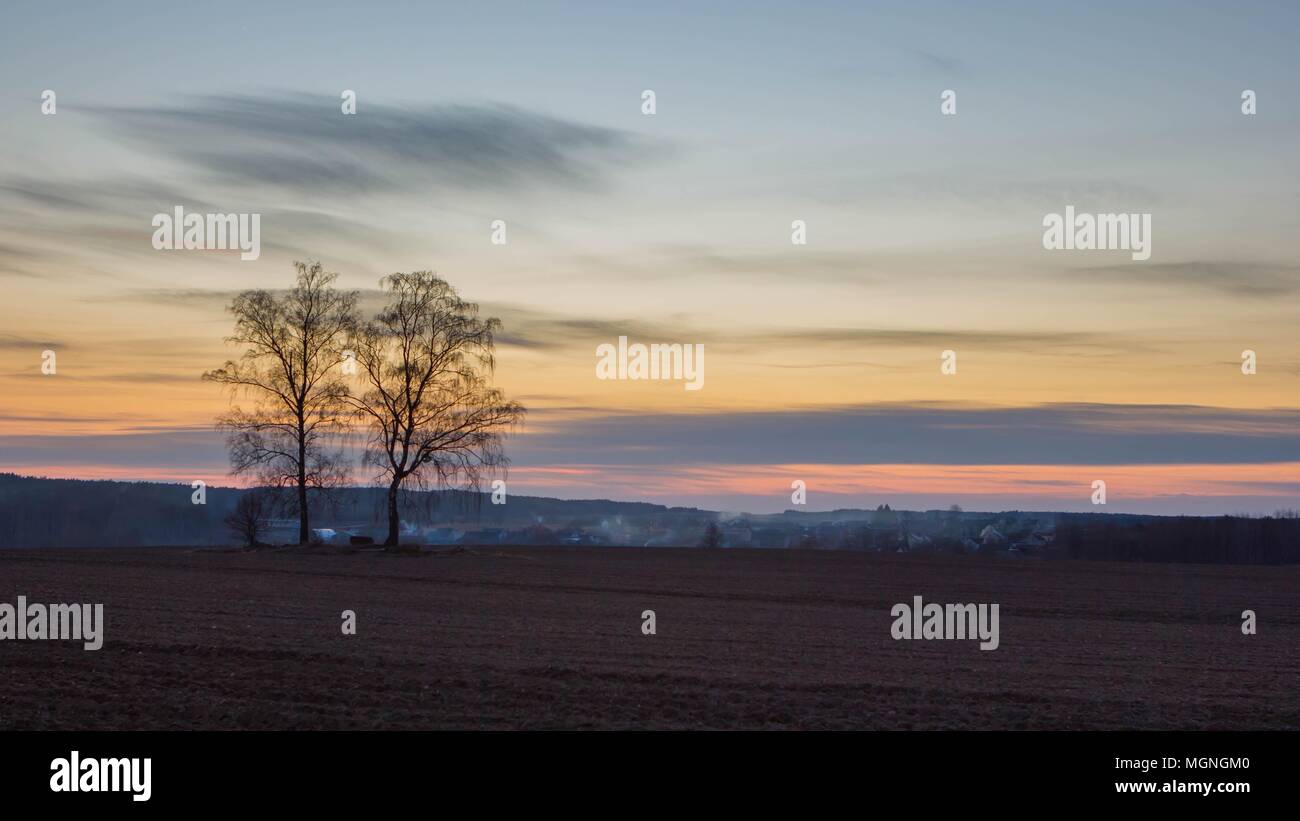 Late evening sky over village near fields. Rural landscape Stock Photo ...