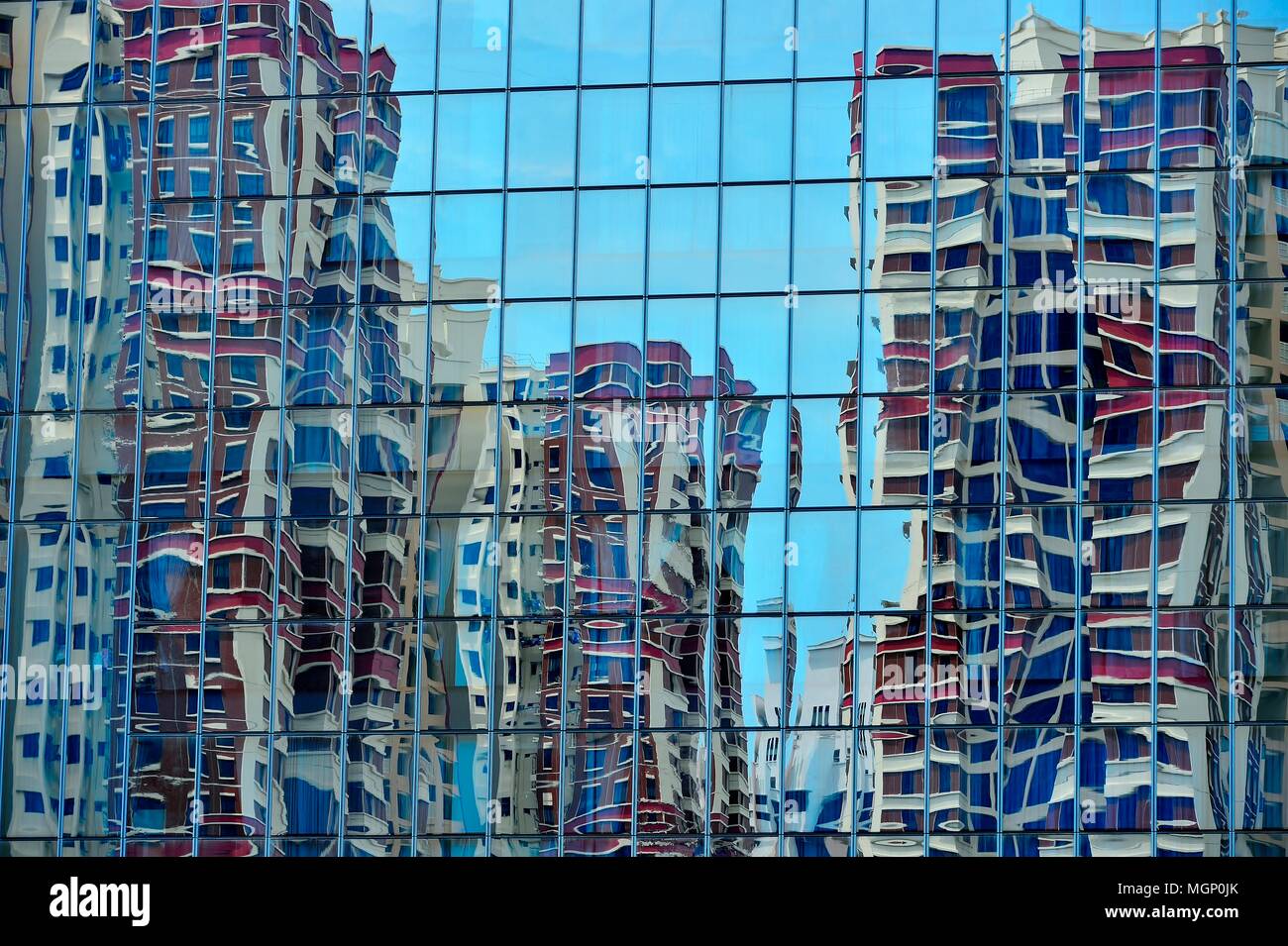 Front view of large modern office building in Singapore with glass ...