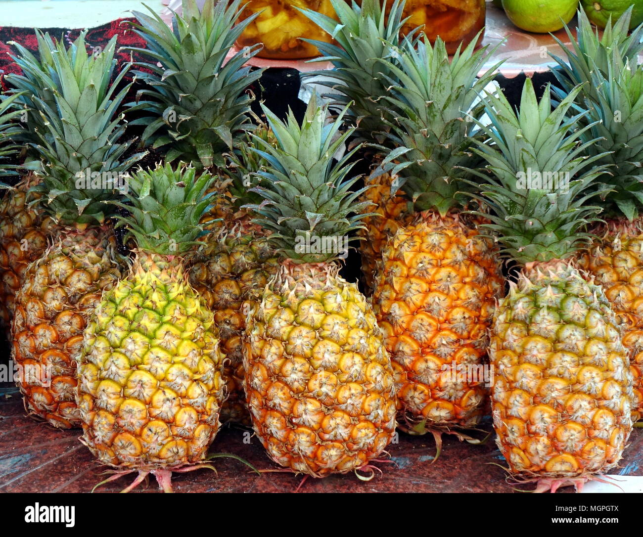 Fresh ripe pineapples are sold at the local market Stock Photo - Alamy