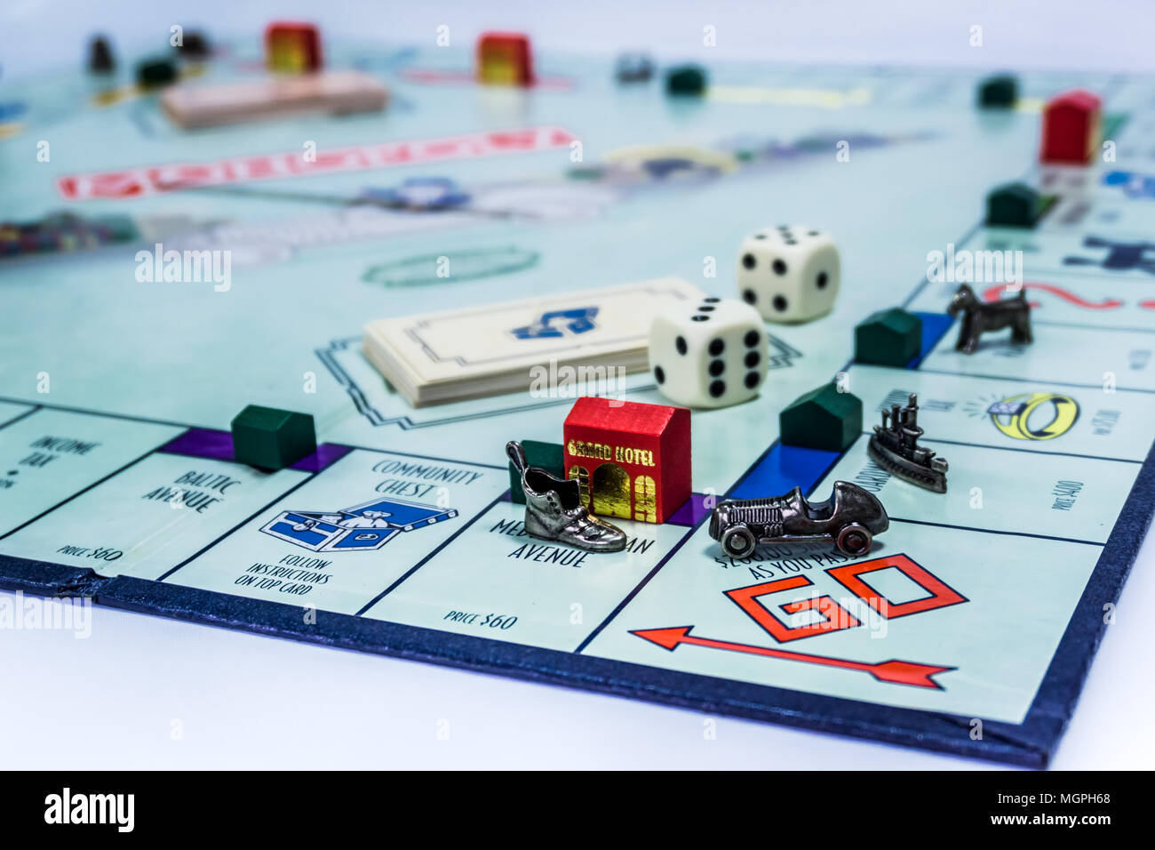 Monopoly Board Game close up with the car passing the GO Stock Photo ...