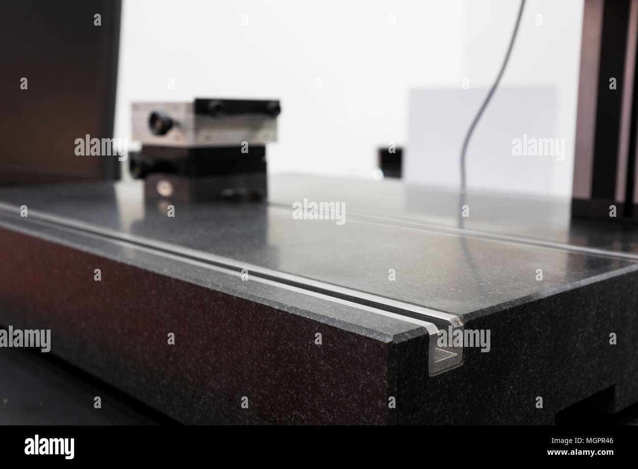 GRANITE SURFACE PLATE in CMM machine ; close up Stock Photo - Alamy