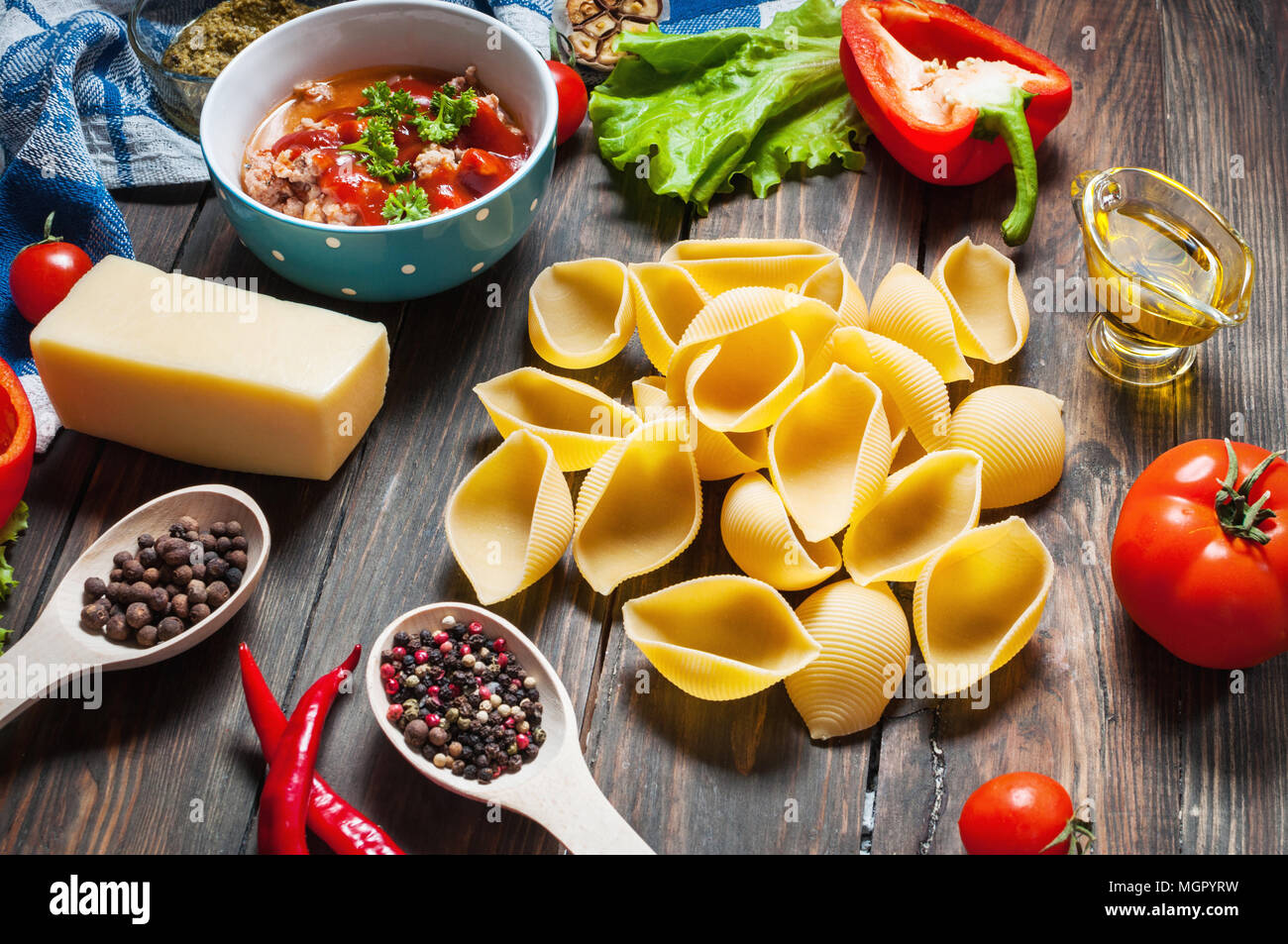 Raw Conchiglioni with minced meat and vegetables on dark wooden ...