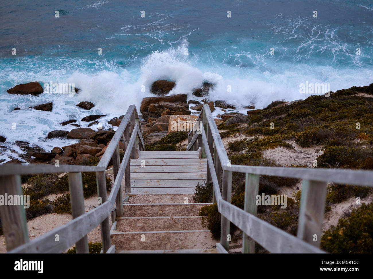 Waves crashing into rocks Stock Photo - Alamy