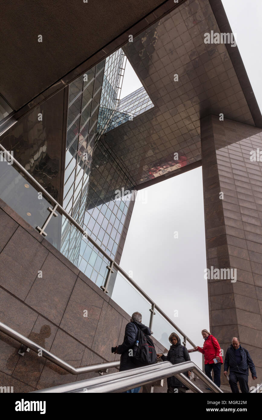 Some people walking down or up the steps or stairs at number one 1 ...