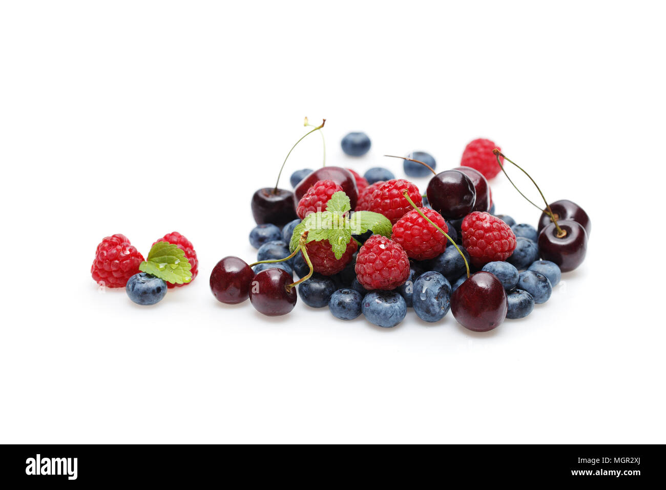 blueberry, cherry and raspberry berries isolated on white background ...