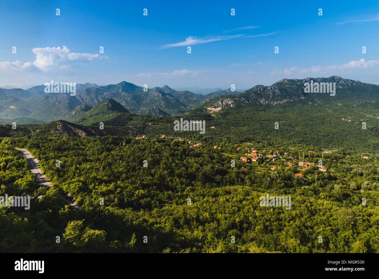 Montenegro landscape with balkan mountain village, road and rocks by ...