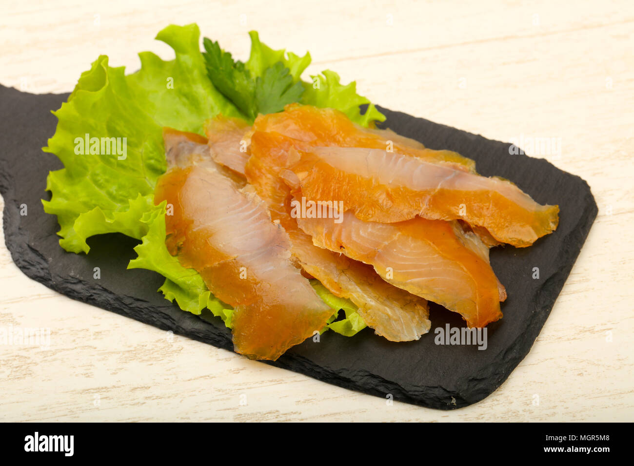 Smoked catfish fillet carpaccio Stock Photo - Alamy
