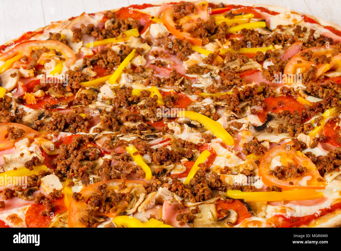 Pizza with minced meat and vegetables Stock Photo - Alamy