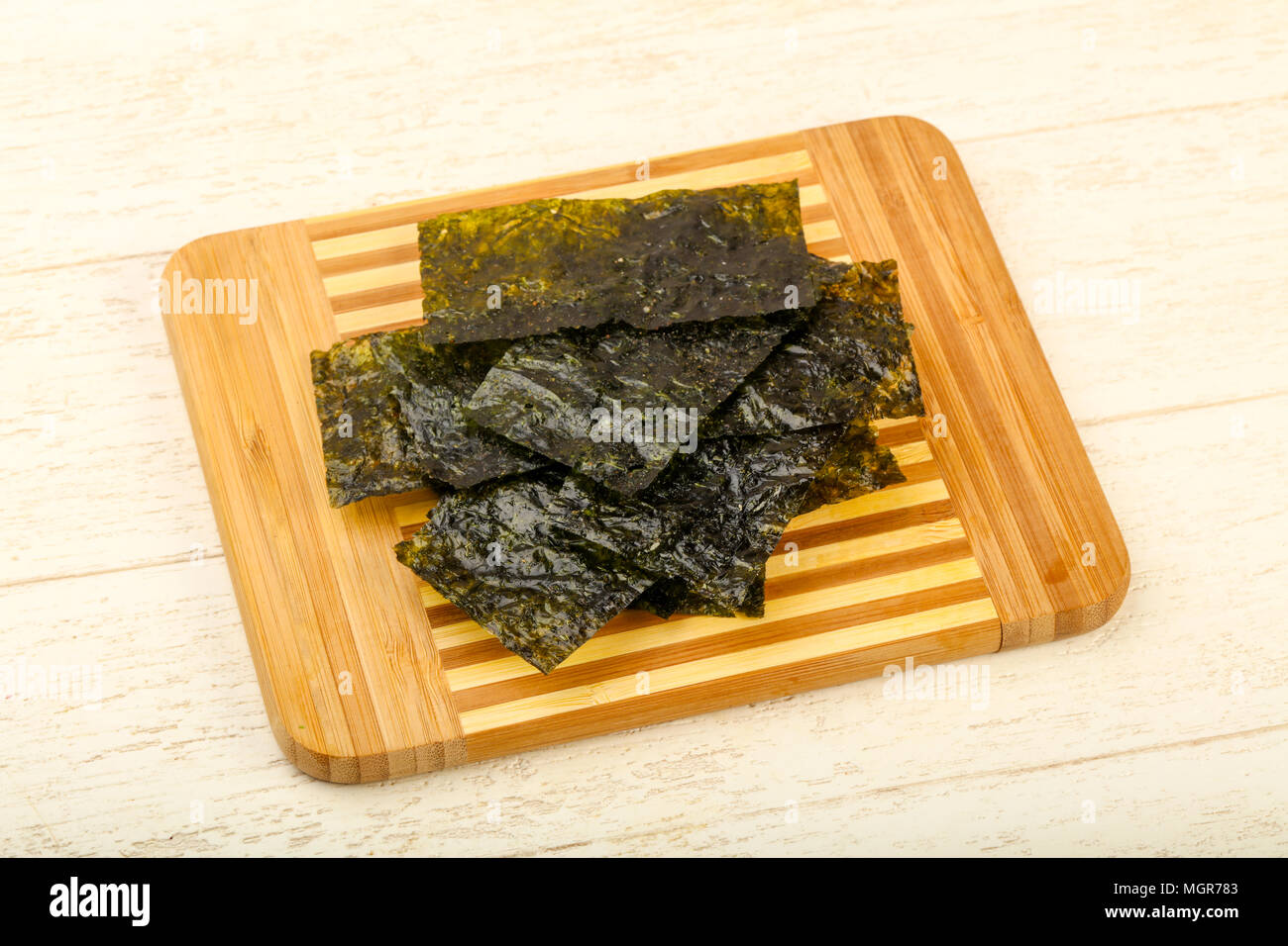 Crispy Nori sheets chips over wooden background Stock Photo - Alamy