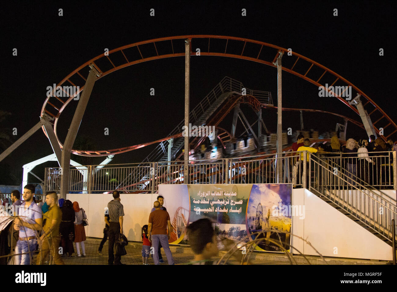 picture for Iraqi kids riding some games in Zawraa park in Baghdad city ...