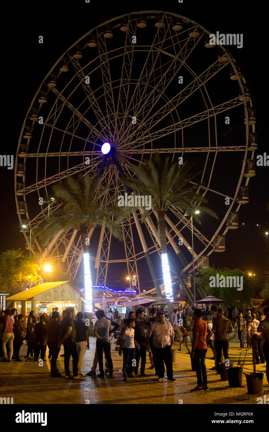 picture for Iraqi kids riding some games in Zawraa park in Baghdad city ...