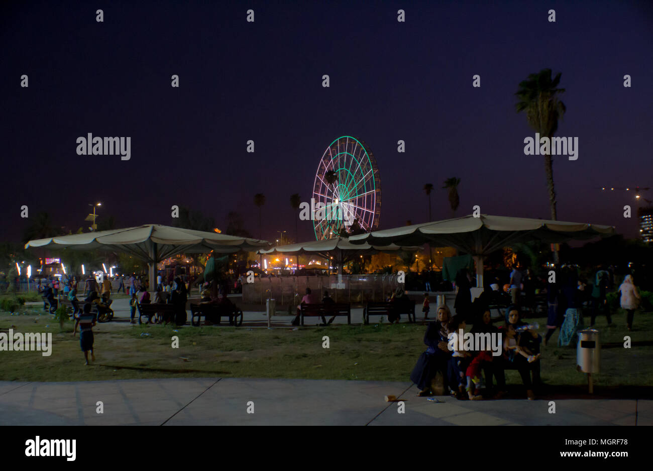 picture for Iraqi kids riding some games in Zawraa park in Baghdad city ...