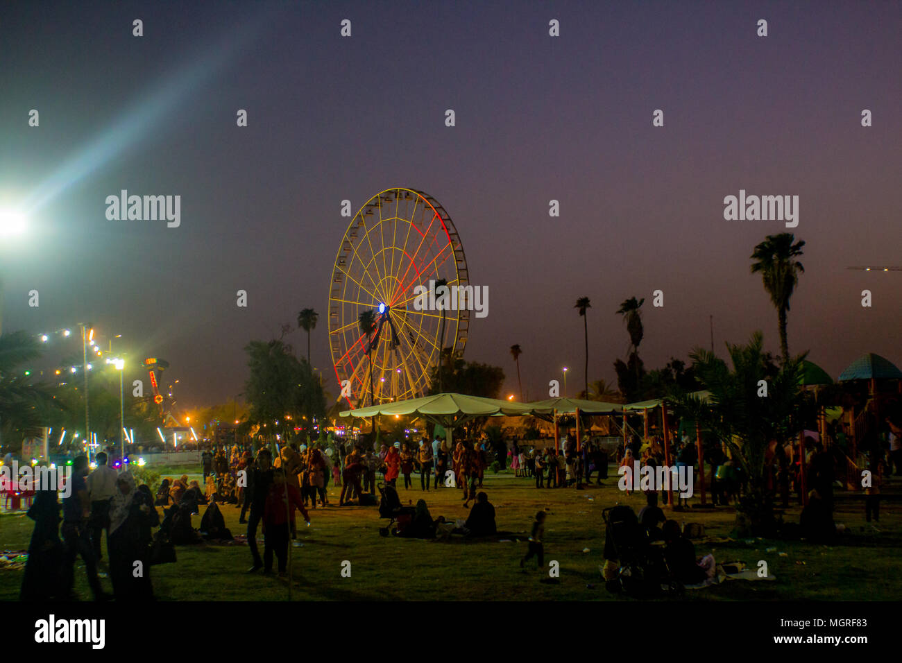 picture for Iraqi kids riding some games in Zawraa park in Baghdad city ...