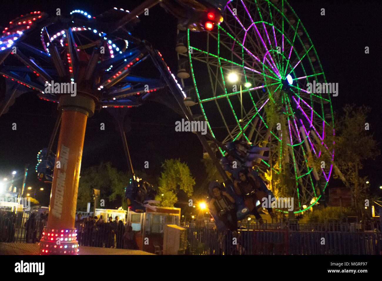 picture for Iraqi kids riding some games in Zawraa park in Baghdad city ...