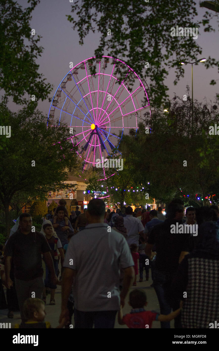 picture for Iraqi kids riding some games in Zawraa park in Baghdad city ...