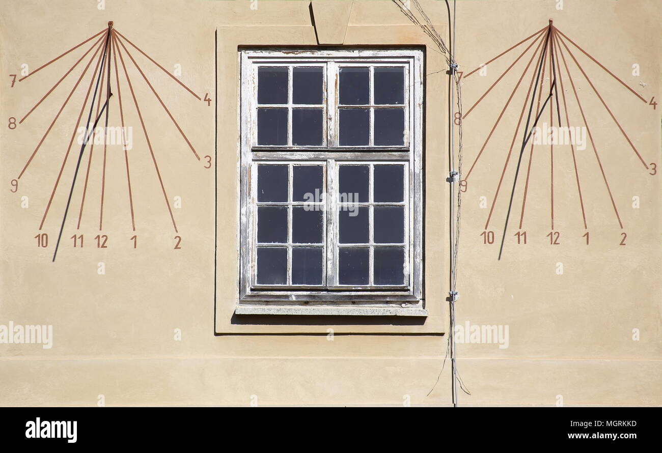 Window with two sun dials in sunlight Stock Photo - Alamy