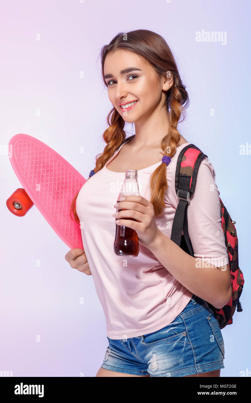 beautiful woman with skate in studio Stock Photo - Alamy