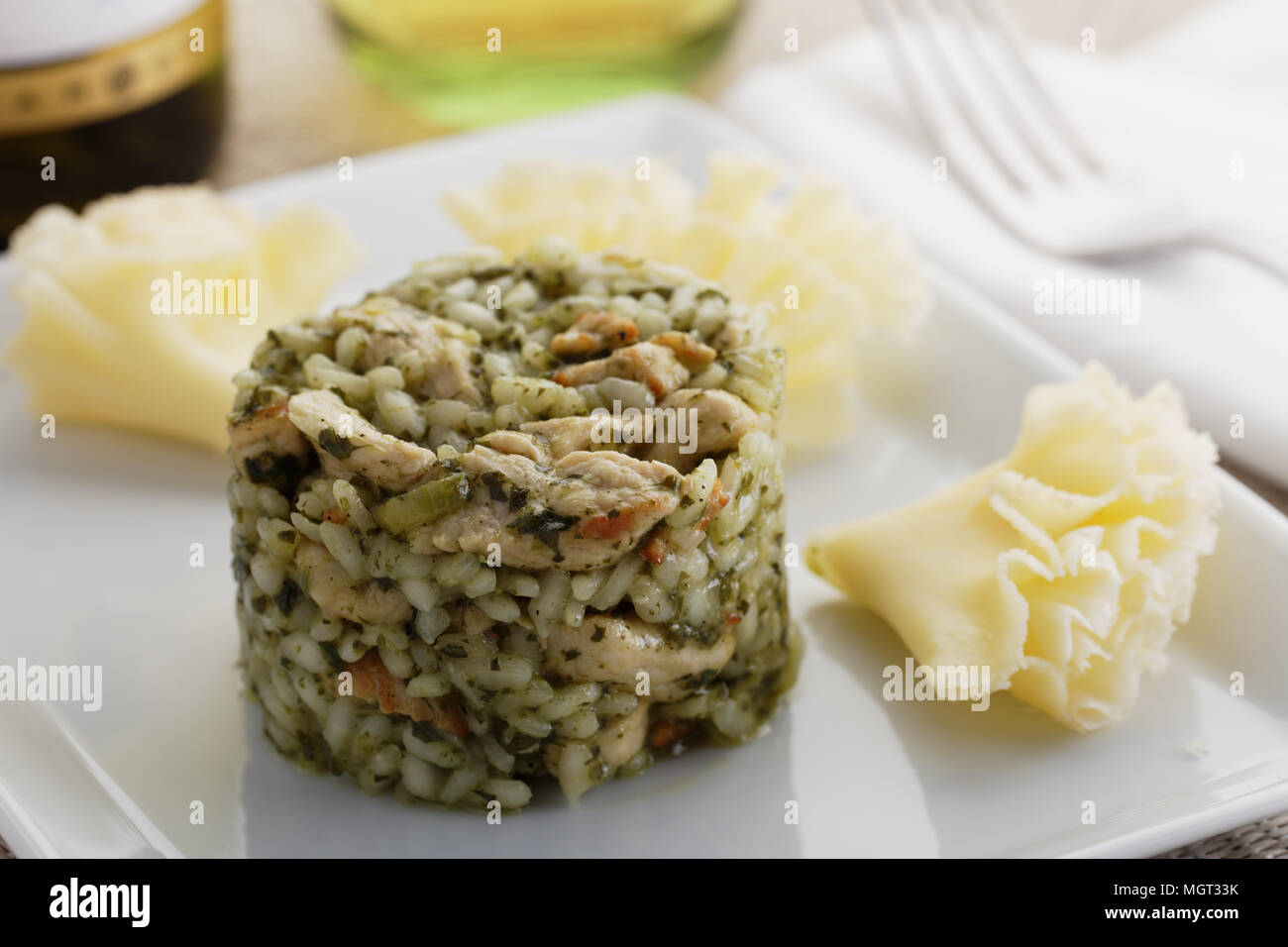 Chicken and pesto risotto with cheese Stock Photo - Alamy