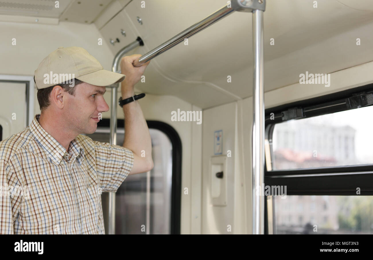 Man in the train of fast transit system Stock Photo - Alamy