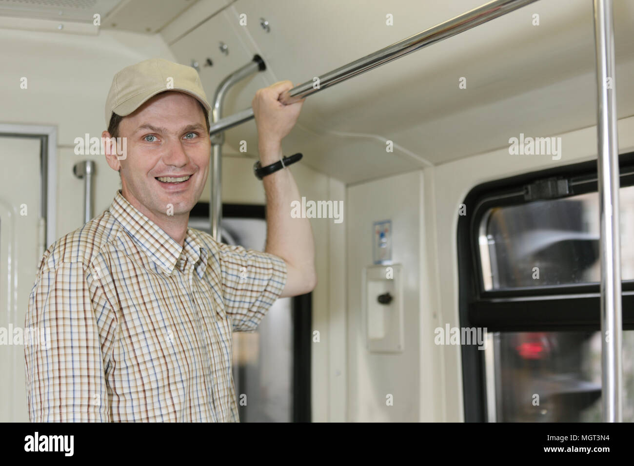Man in the train of fast transit system Stock Photo - Alamy