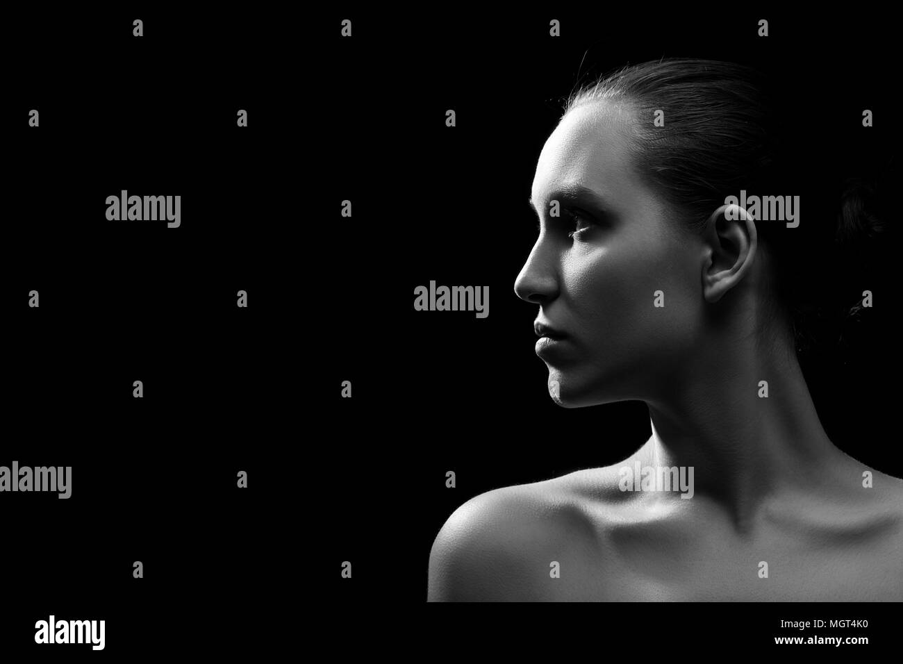 serious female profile on black background with copy space Stock Photo ...