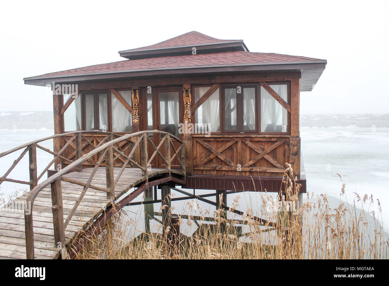 A beautiful house on the water. On the dock Stock Photo - Alamy