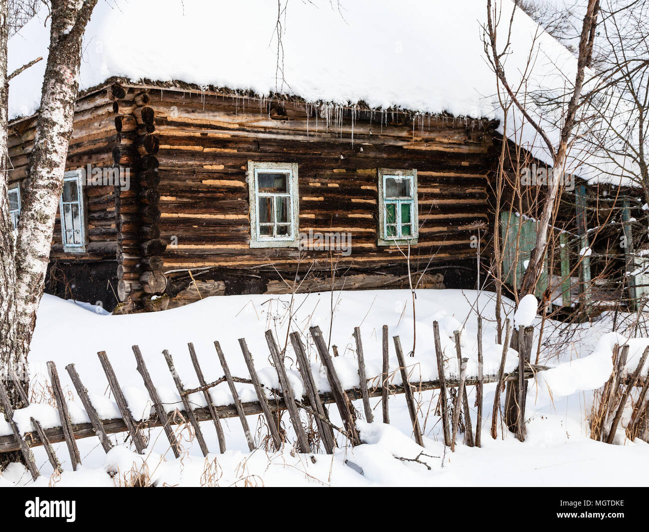 old russian wooden rural house in winter in little village in Smolensk ...