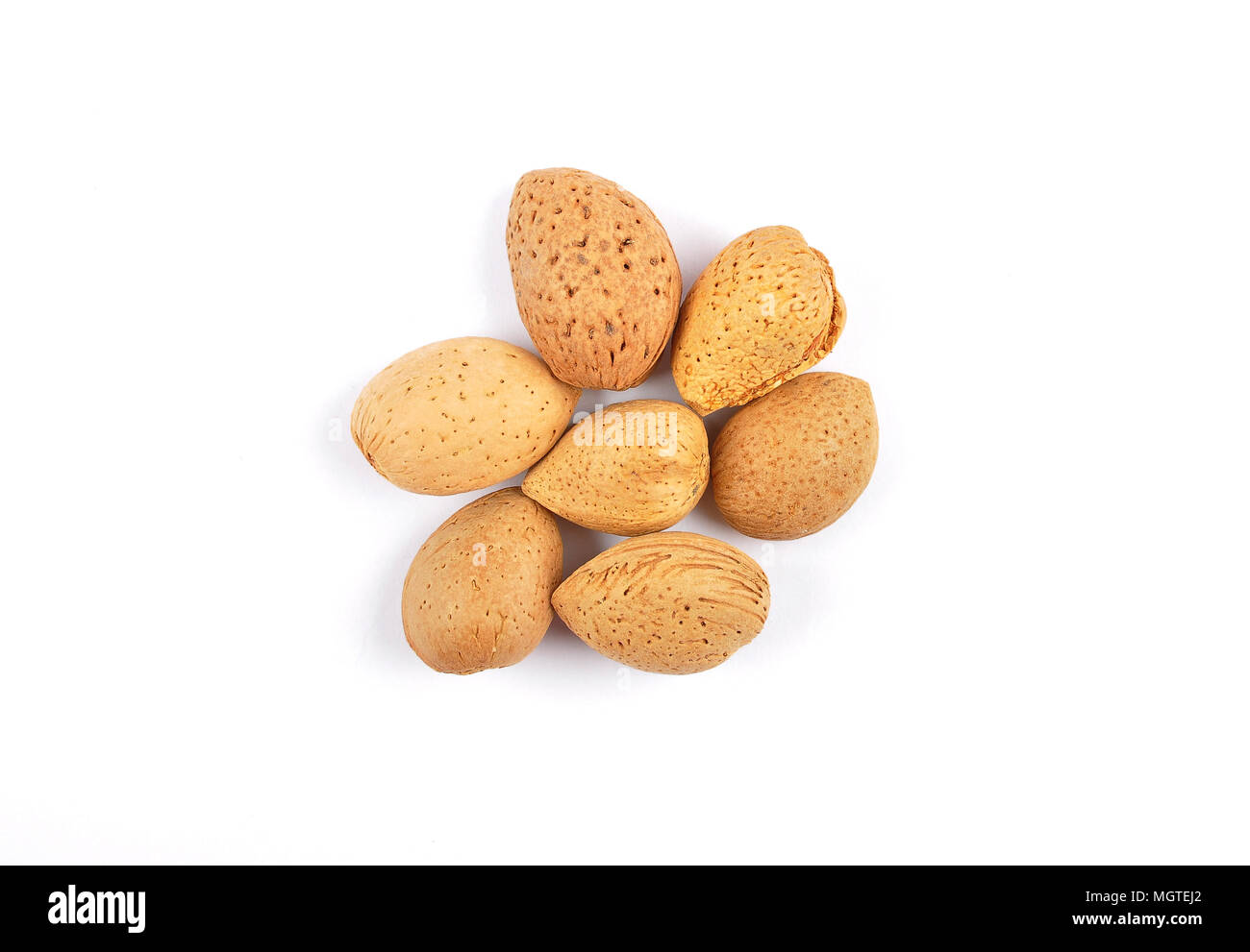 Almonds in shell on white Stock Photo - Alamy