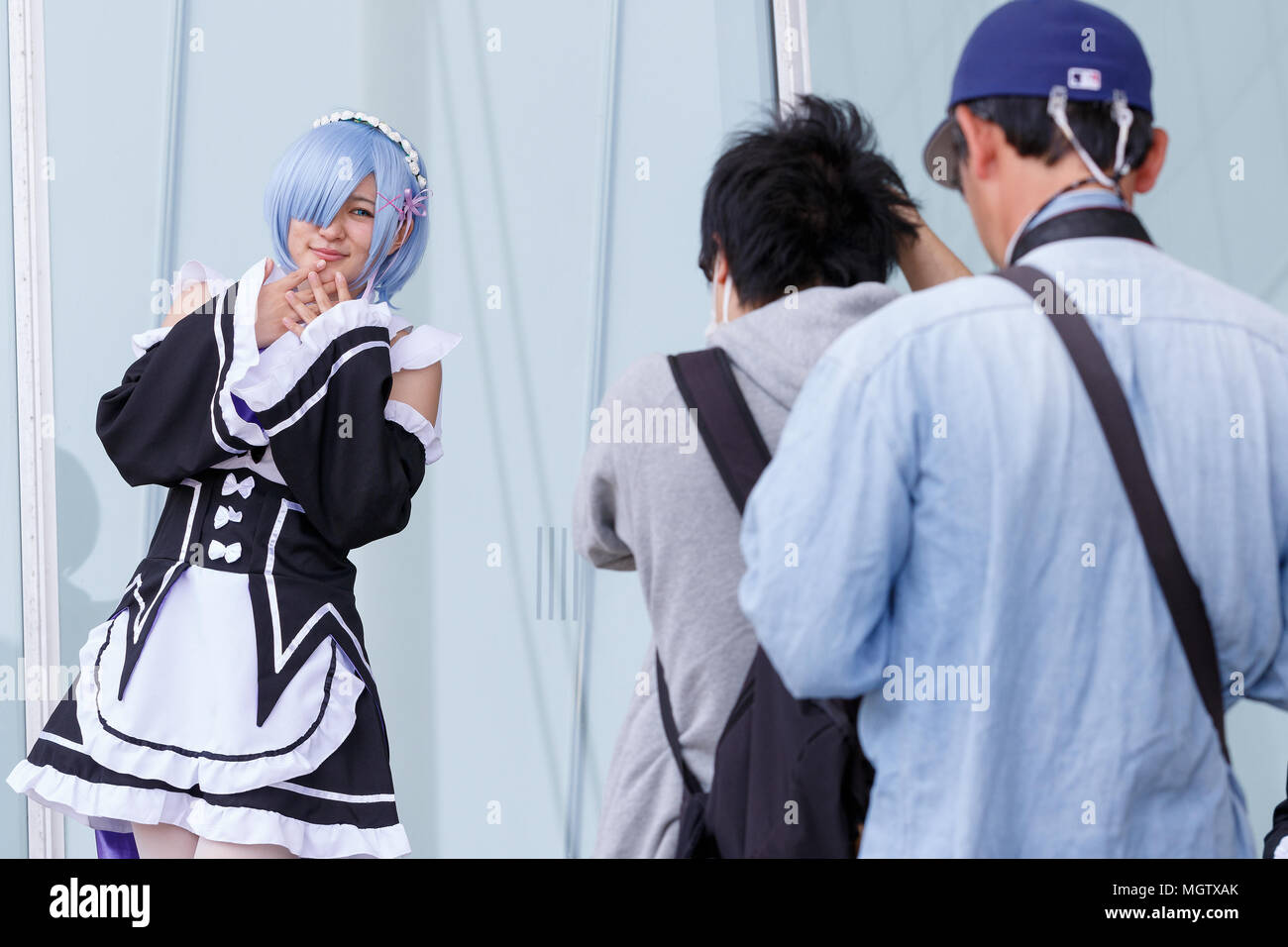A cosplayer poses for a photographer during the Niconico Chokaigi ...