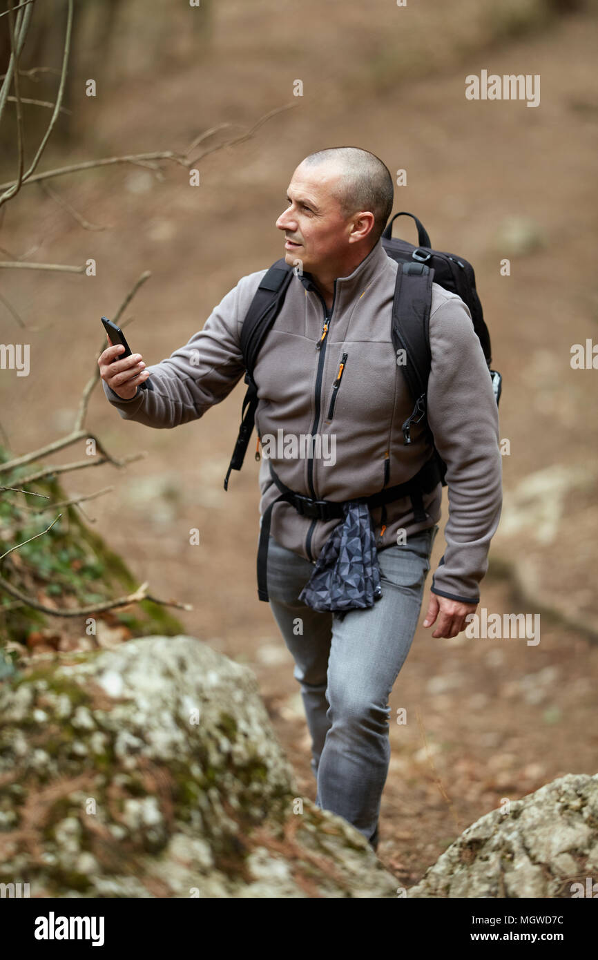 Hiker checking gps map hi-res stock photography and images - Alamy