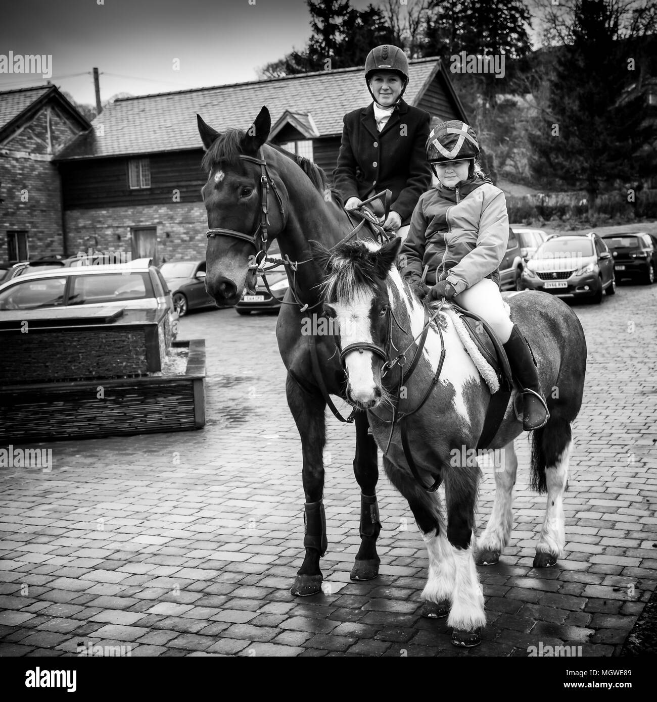 Daughter riding Black and White Stock Photos & Images - Alamy