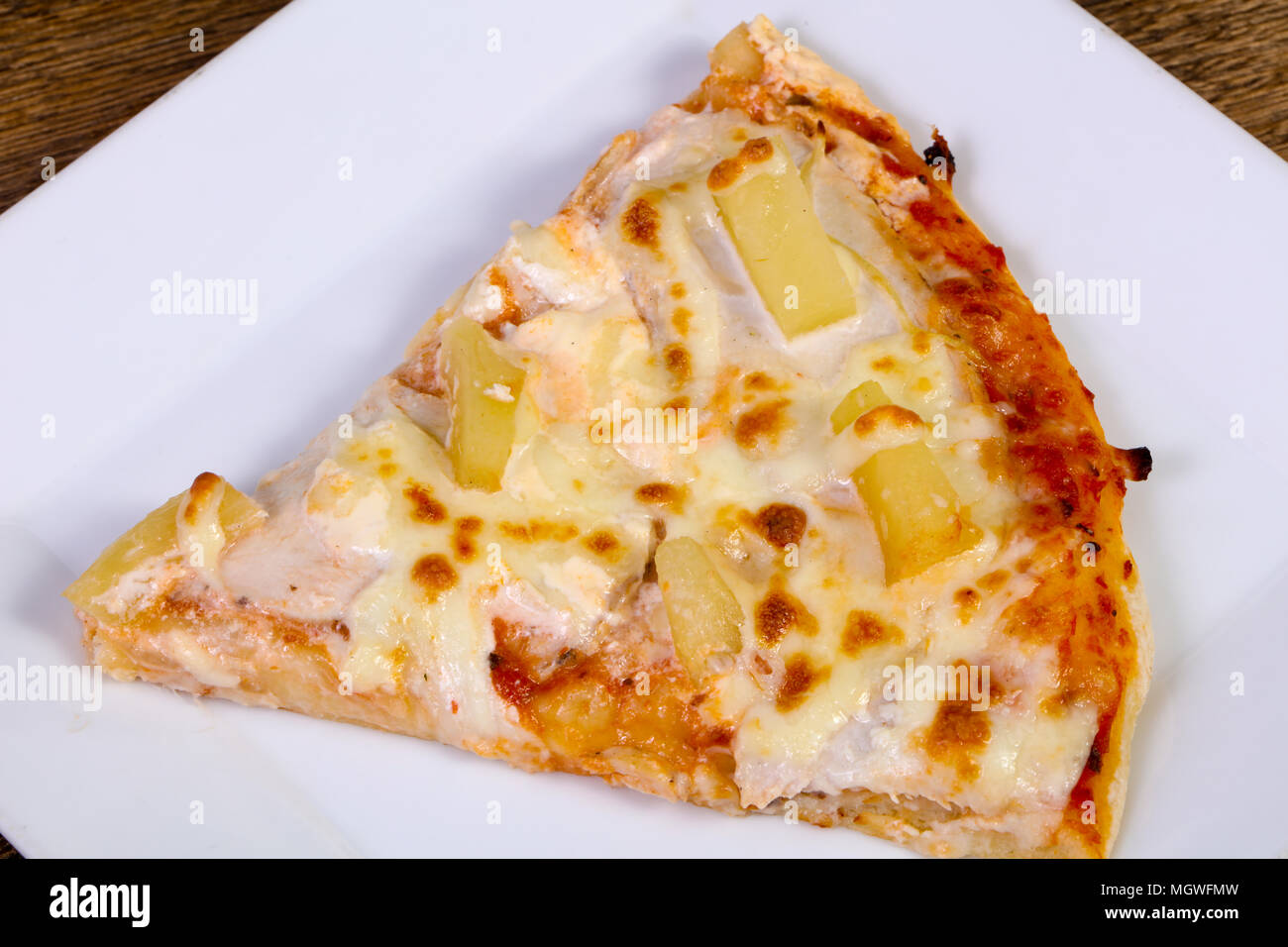 Pineapple pizza with soft cheese Stock Photo - Alamy