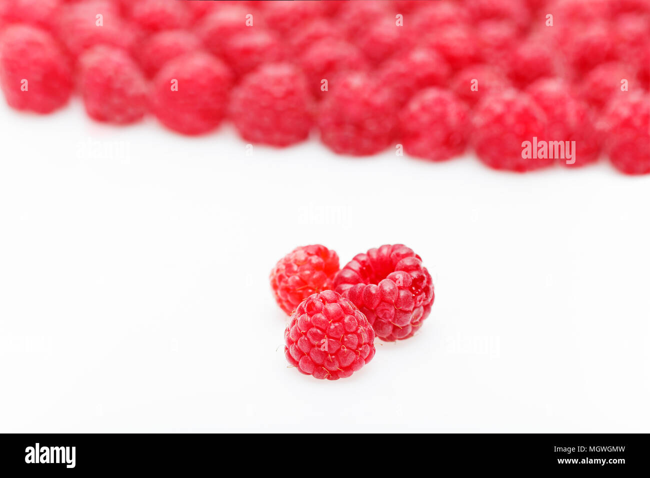 raspberry berries isolated on white Stock Photo - Alamy