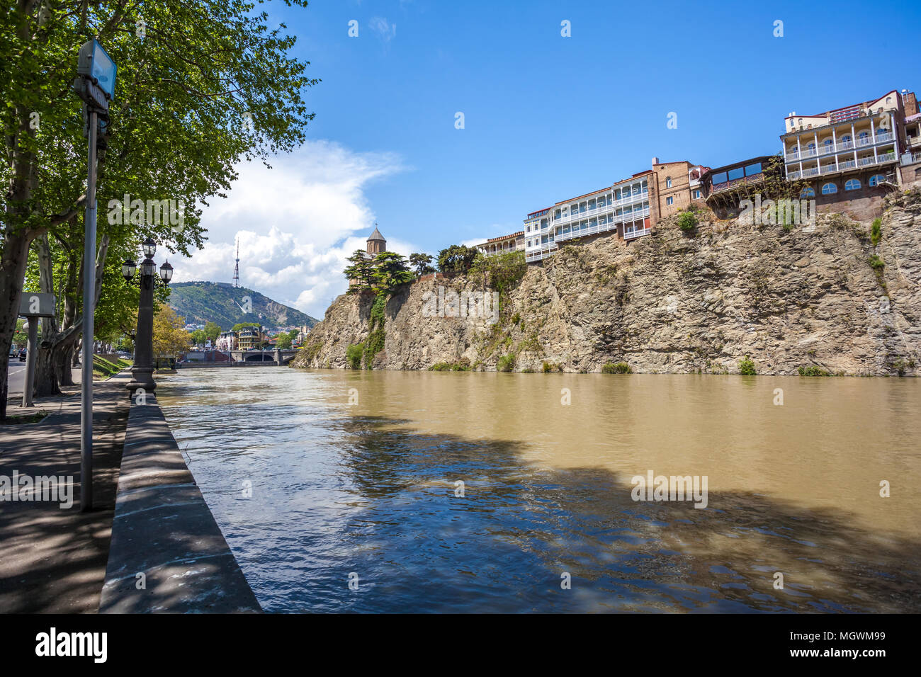 Metekhi church and Houses on the edge of a cliff above the river Kura ...