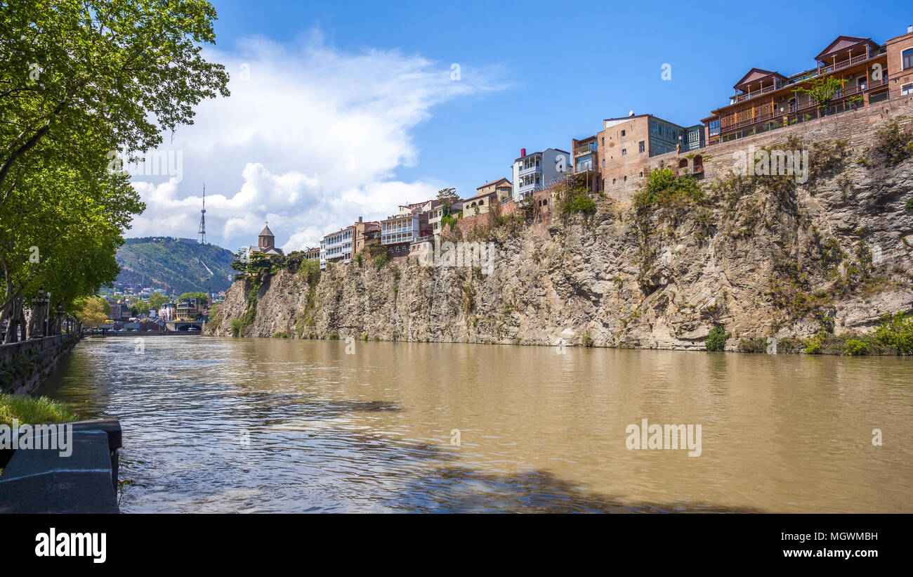 Metekhi church and Houses on the edge of a cliff above the river Kura ...